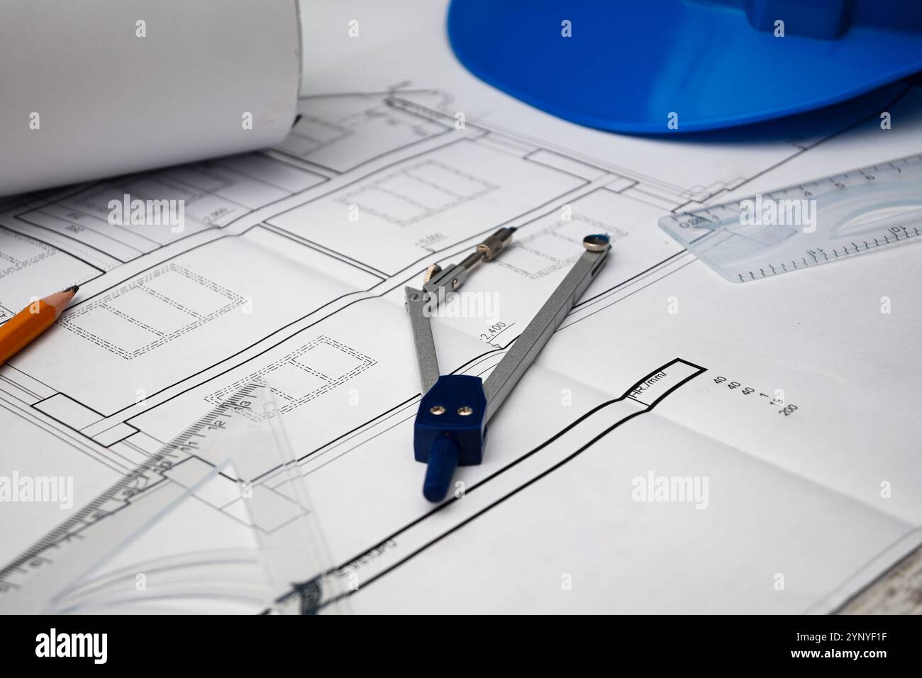 Architectural project being designed with pencil, compass, ruler and ...