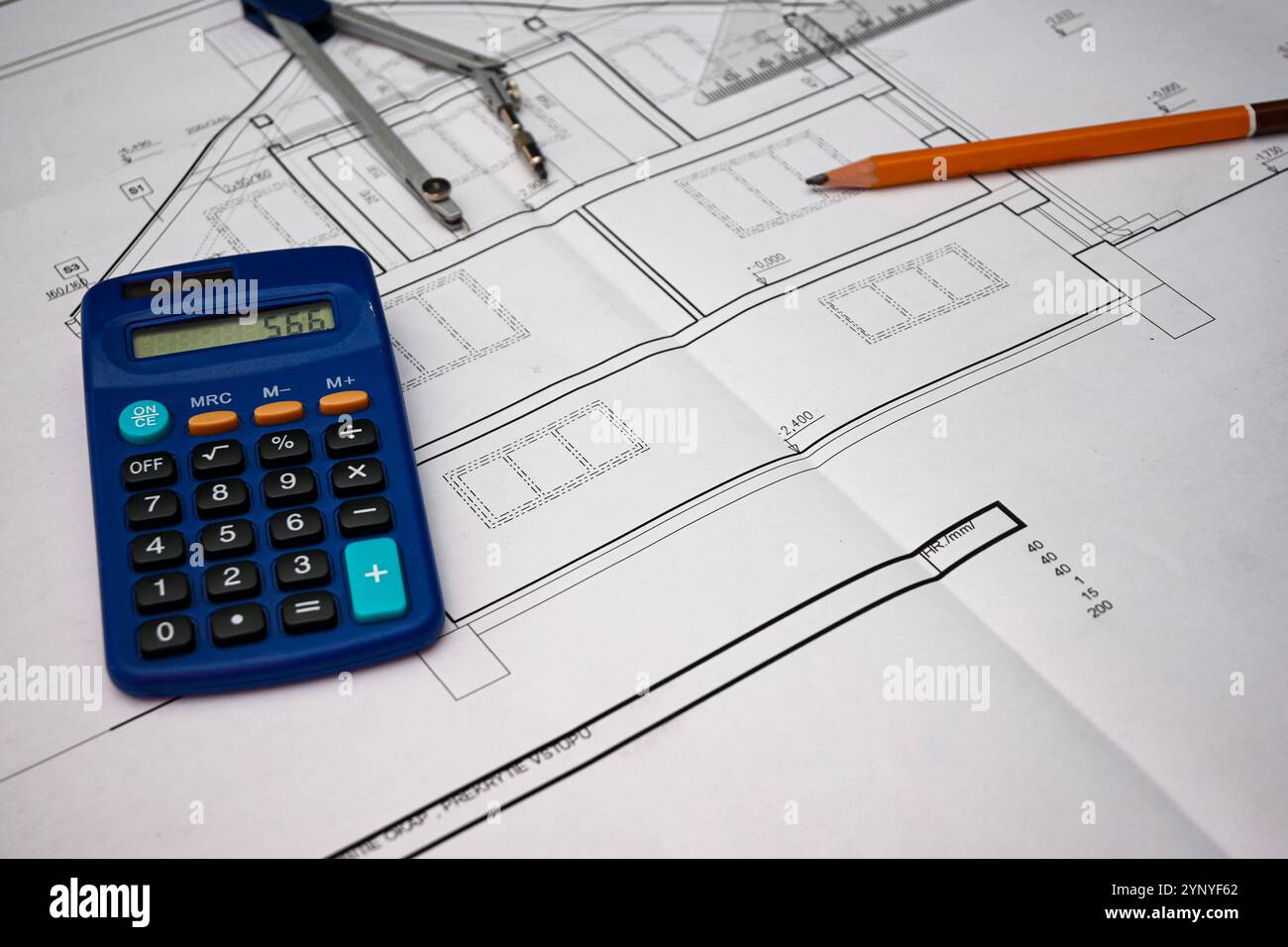 Architectural project being drawn using compass, ruler, pencil and ... Architectural project being drawn using compass, ruler, pencil and ...