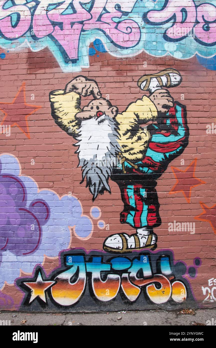 Otis bald white beard man graffiti tagged on a building on Alex ...