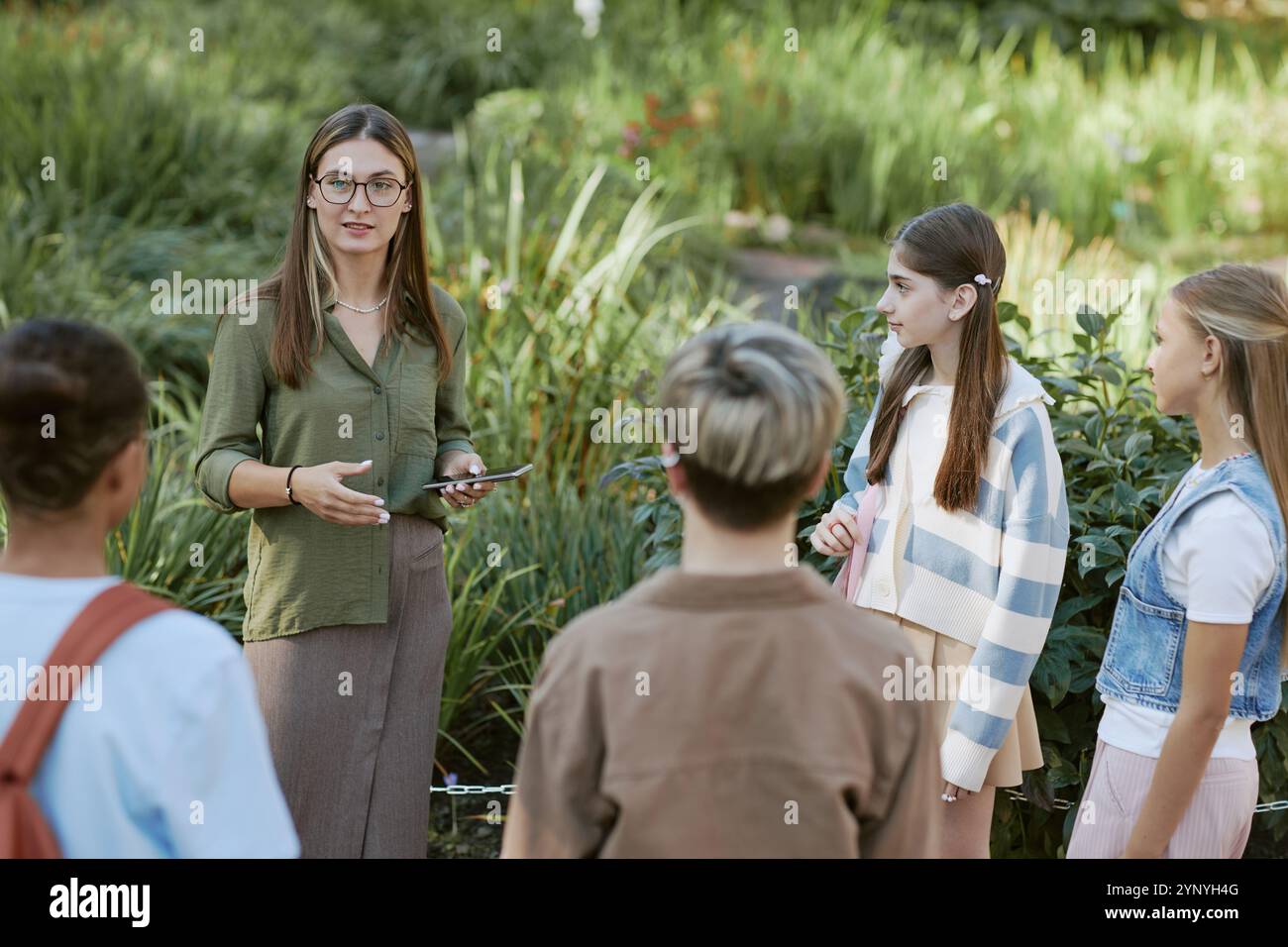 Female Tour Guide Working With Kids Stock Photo - Alamy