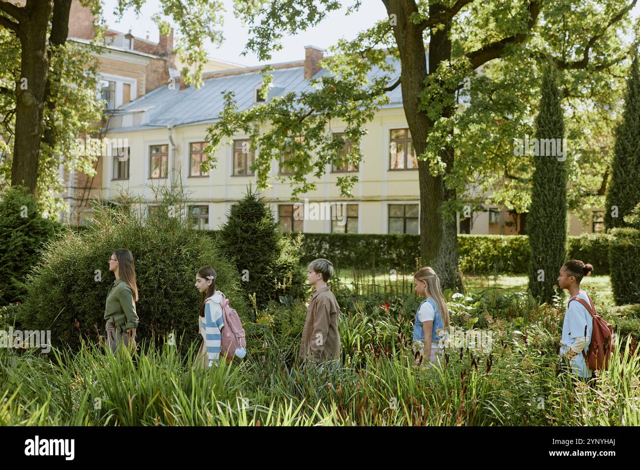 Teenagers Following Their Teacher During Outdoor Lesson Stock Photo - Alamy