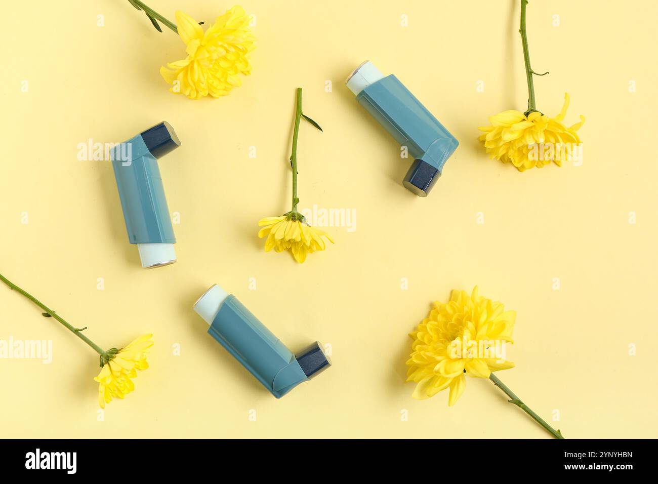 Modern inhalers with chrysanthemum flowers on yellow background Stock ...