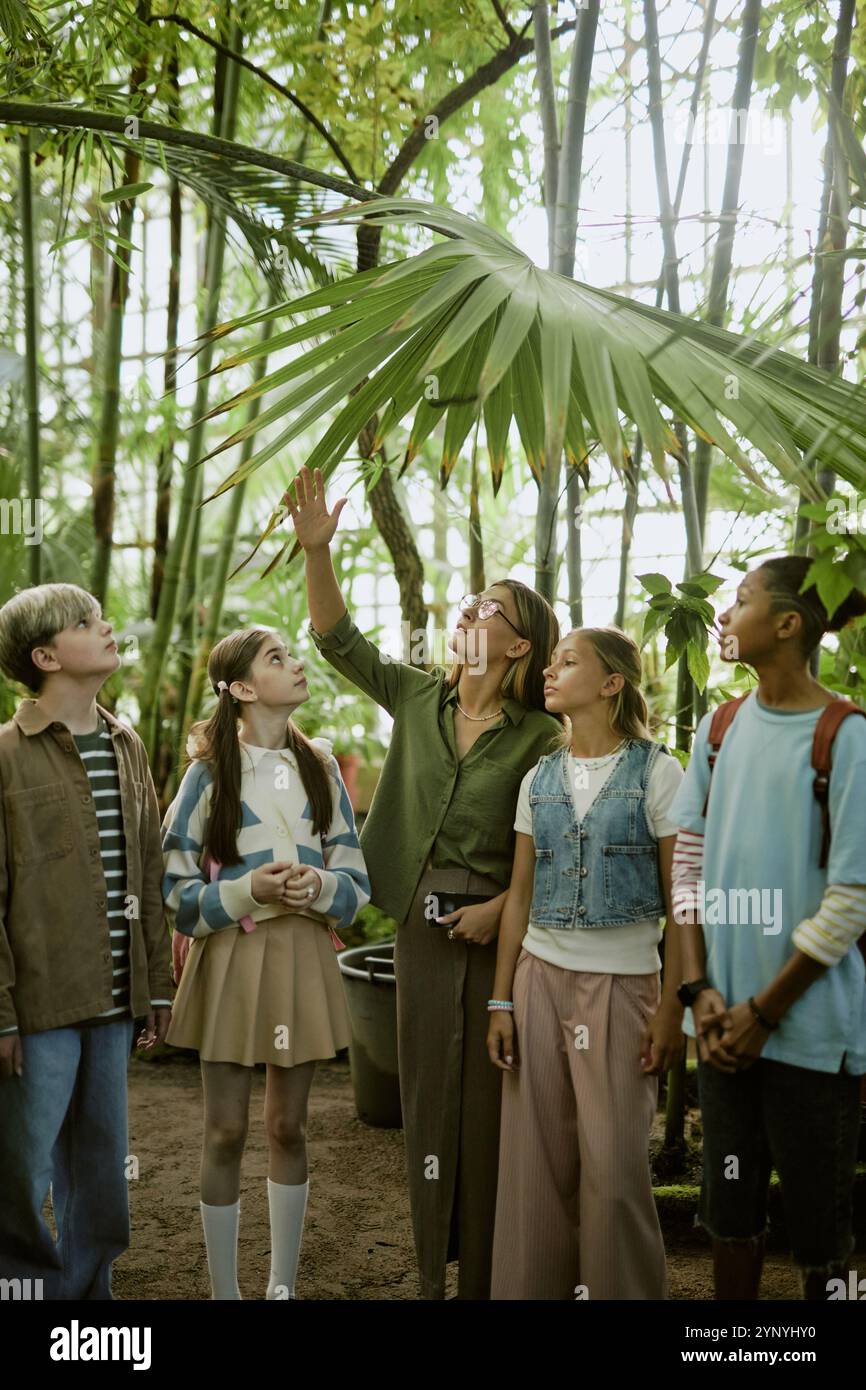 Botanical Garden Worker Showing Plants To Students Stock Photo - Alamy
