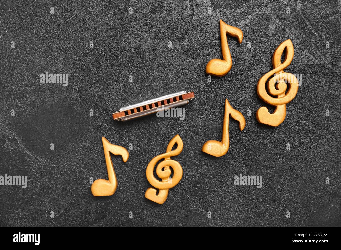 Composition with harmonica and music notes on dark background Stock ...