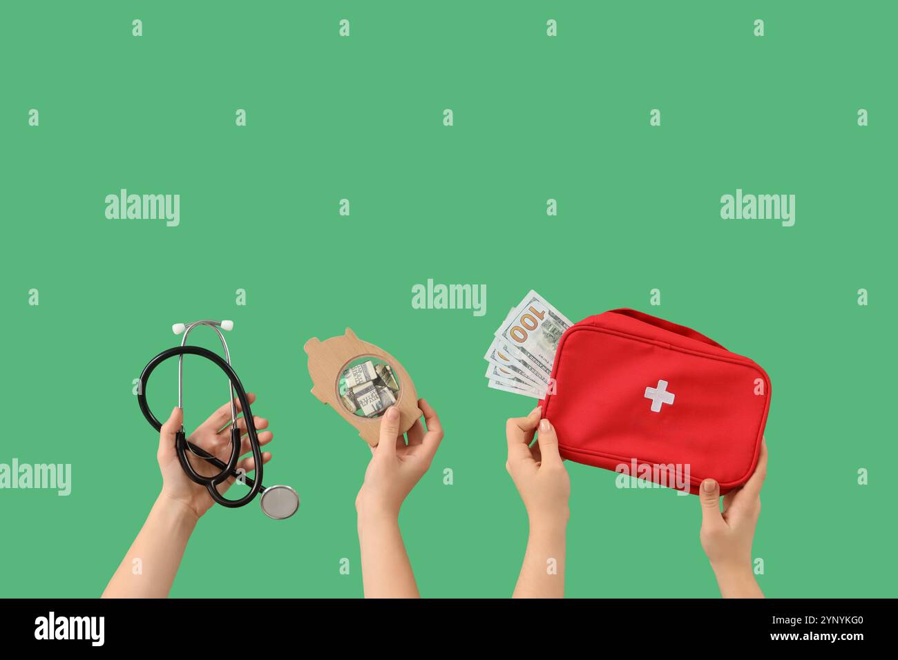 Female doctors with stethoscope, piggy bank and first aid kit on green ...