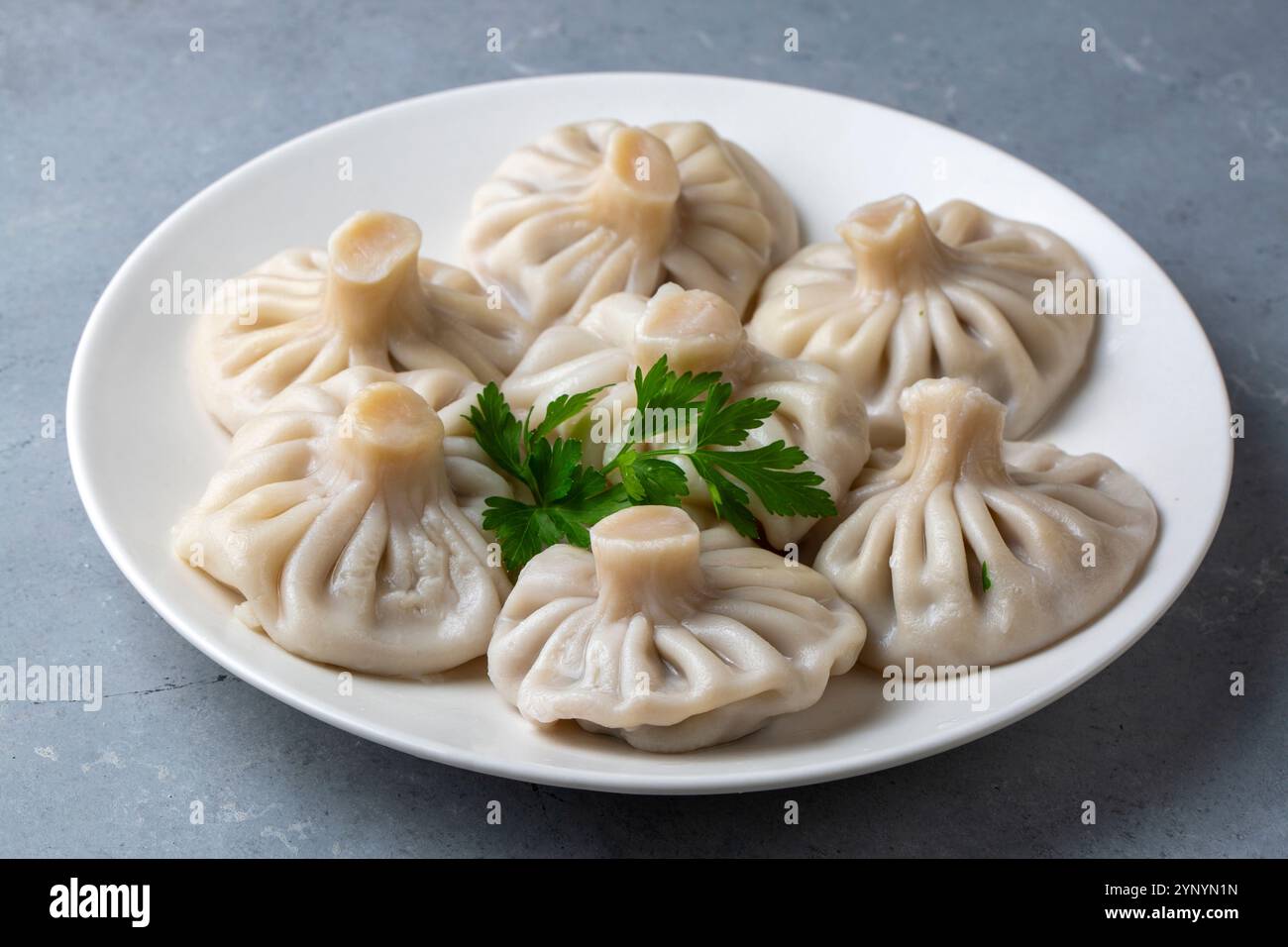 Traditional Georgian dish khinkali - Hinkali - Boiled khinkali with ...