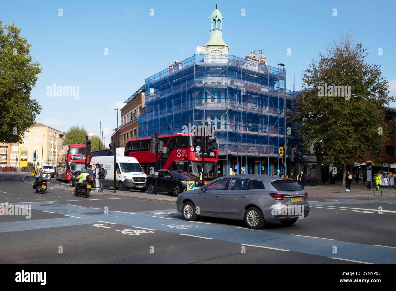 Traffic cars bus and traffic lights outside the White Hart Pub on ...