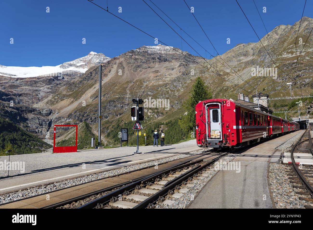 Red train of Bernina in the Swiss alps Stock Photo - Alamy