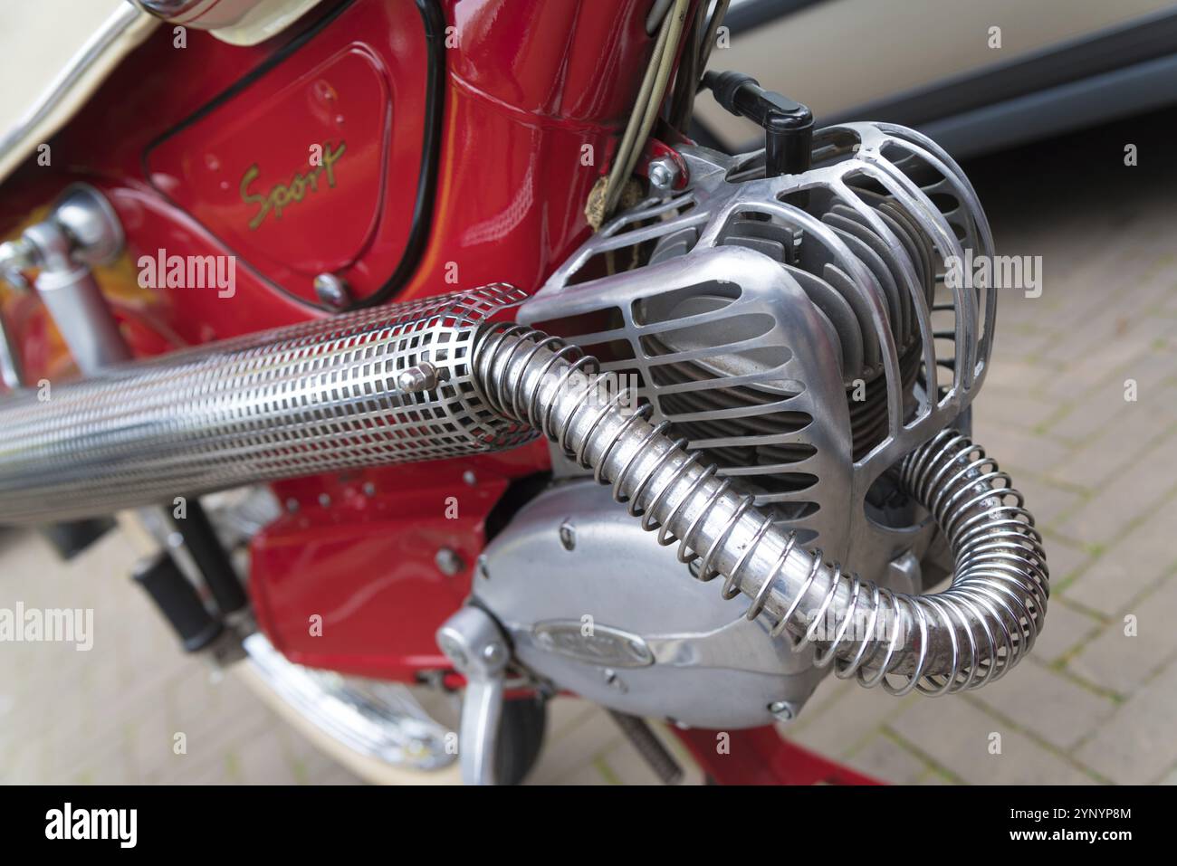 Shiny chrome engine of a classical red moped Stock Photo - Alamy