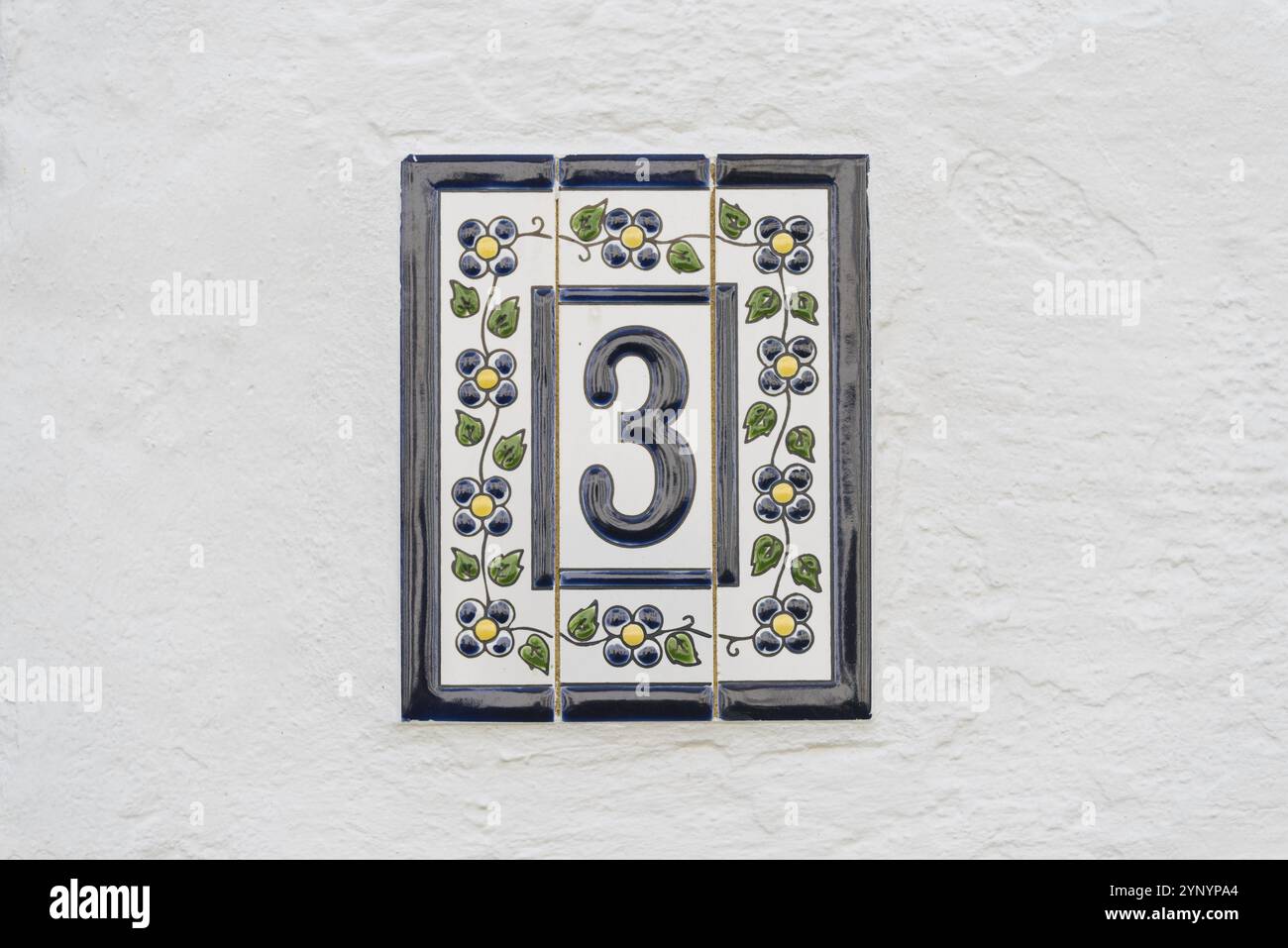 House number three decorated with tiles on a white wall Stock Photo - Alamy