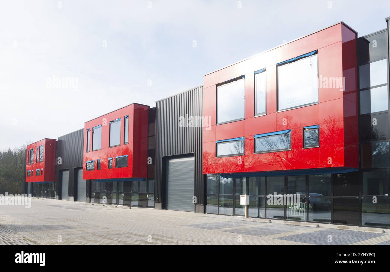 Newly build red industrial warehouse with offices Stock Photo - Alamy