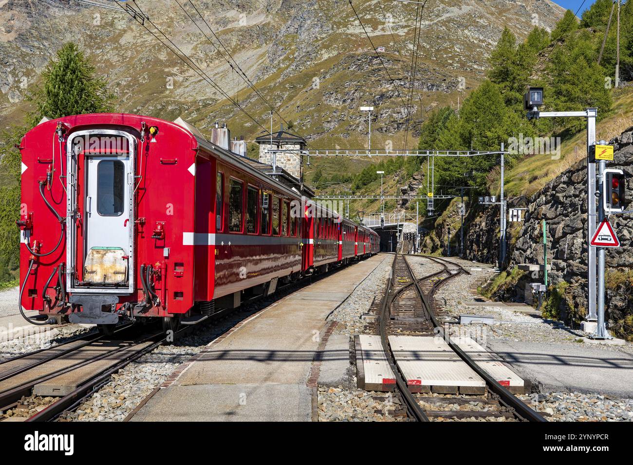 Red train of Bernina in the Swiss alps Stock Photo - Alamy