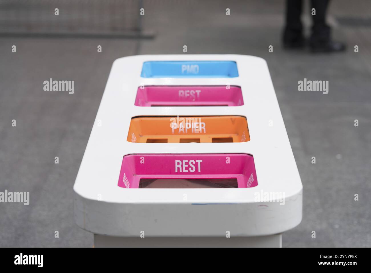 Waste bin in several colors at the antwerp central station Stock Photo ...