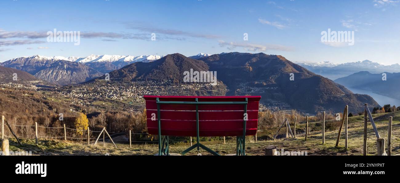 Big red bench on the alps of Lake Como Stock Photo - Alamy