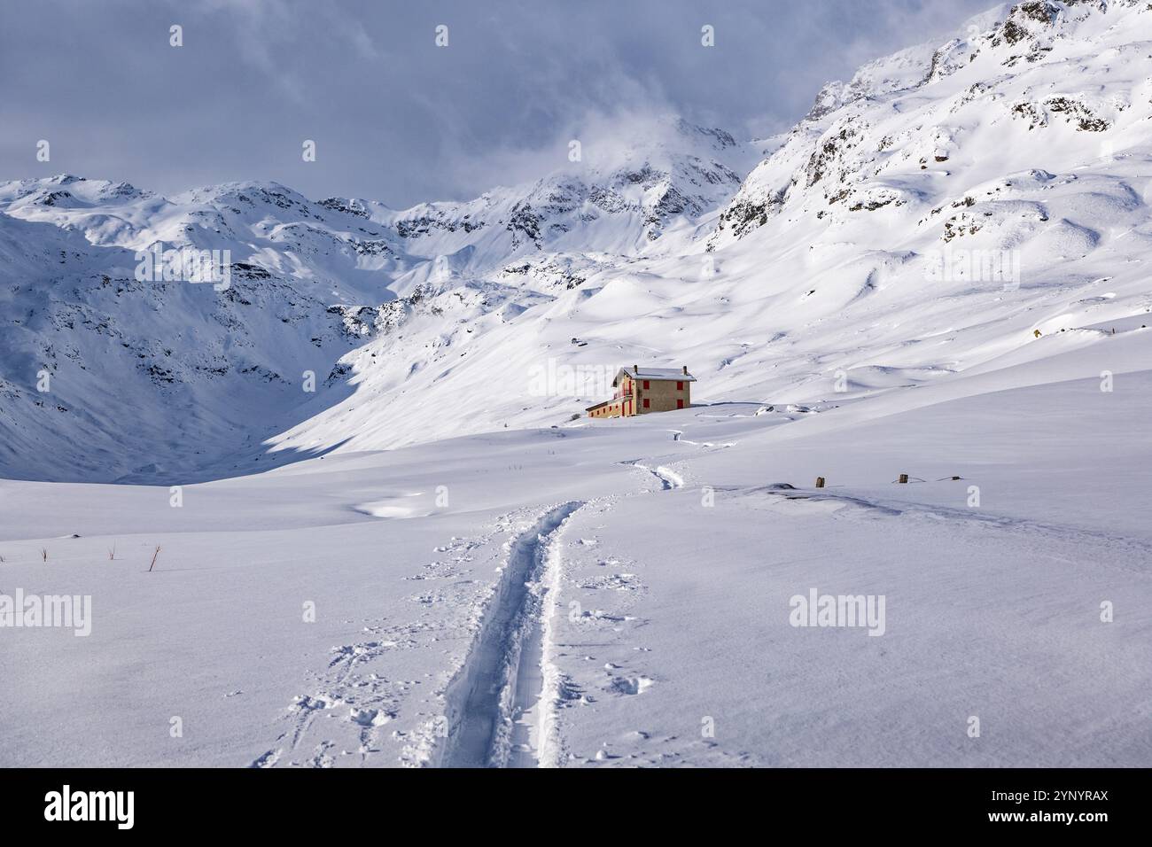 Snowy landscape in the alps of Valchiavenna in Montespluga village ...