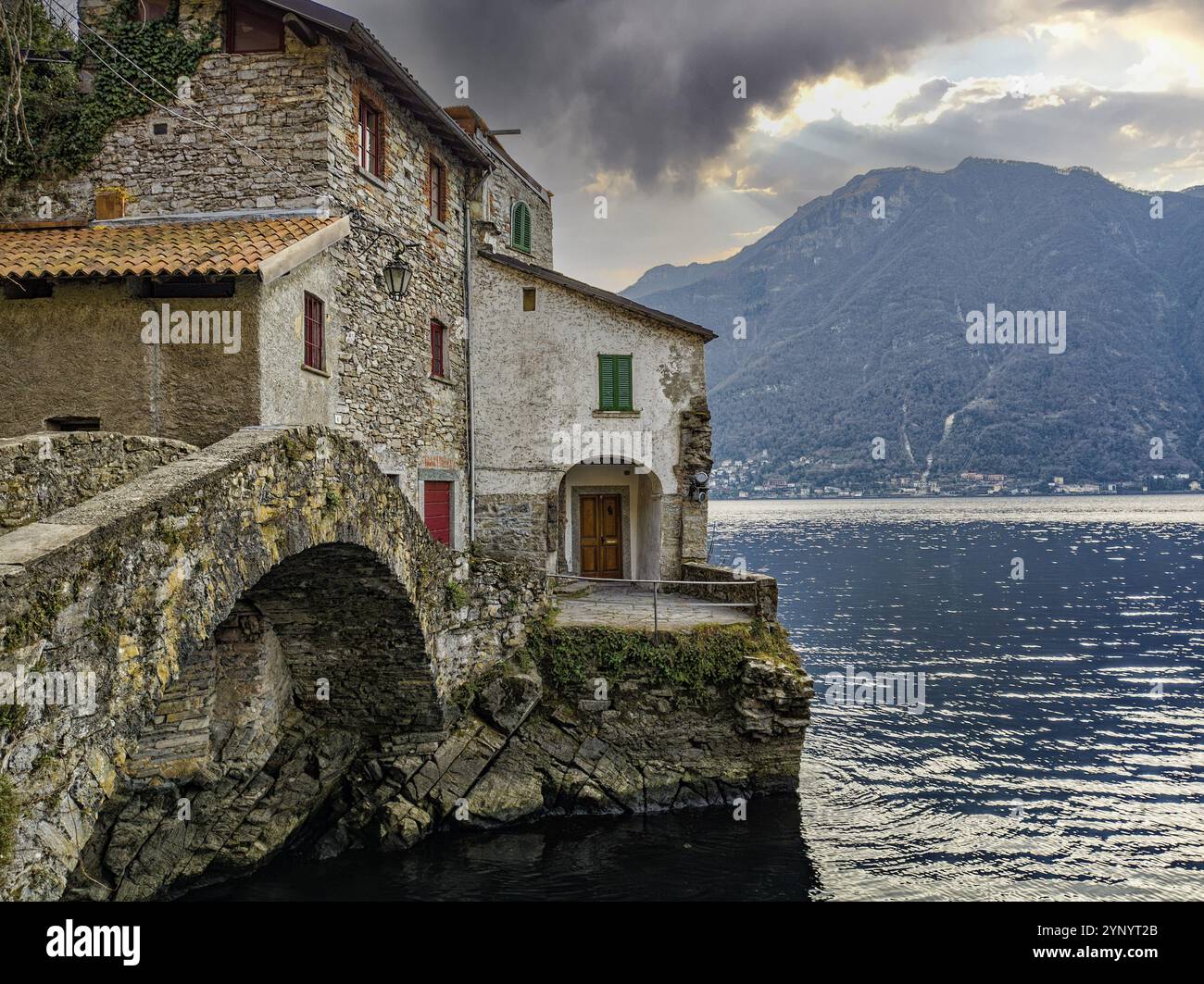 View of the stone bridge of Nesso village on Lake Como Stock Photo - Alamy