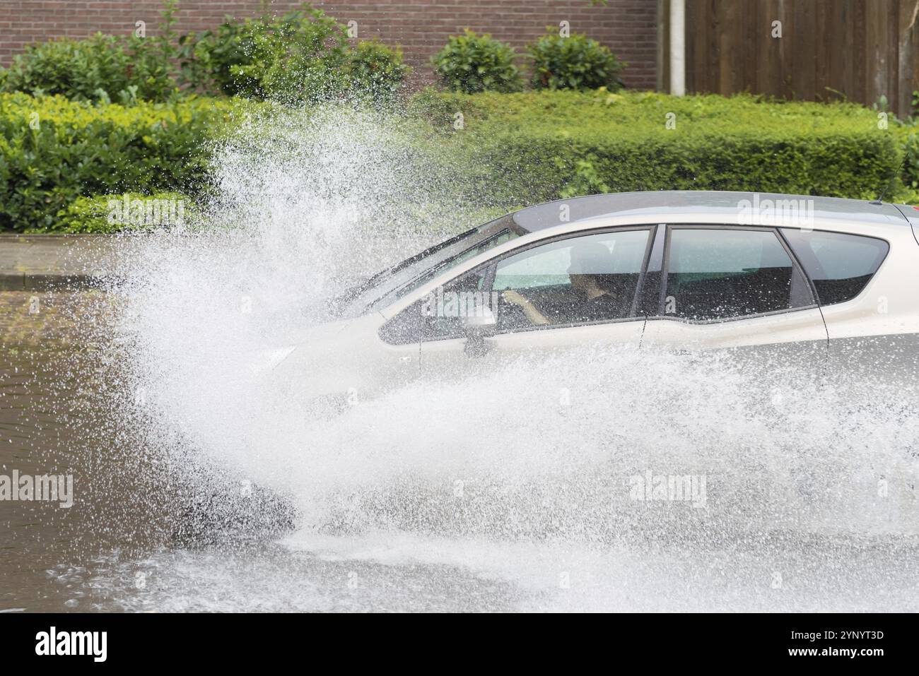Car driving through floodwater hi-res stock photography and images - Alamy