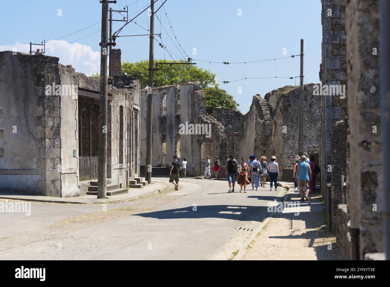 ORADOUR-SUR-GLANE, FRANCE, AUGUST 15, 2016: Tourists between the ruins ...