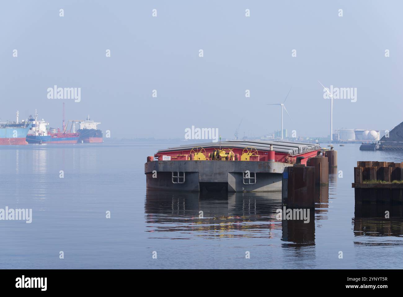 Barge in the port of amsterdam, the 4th largest harbor of europe Stock ...