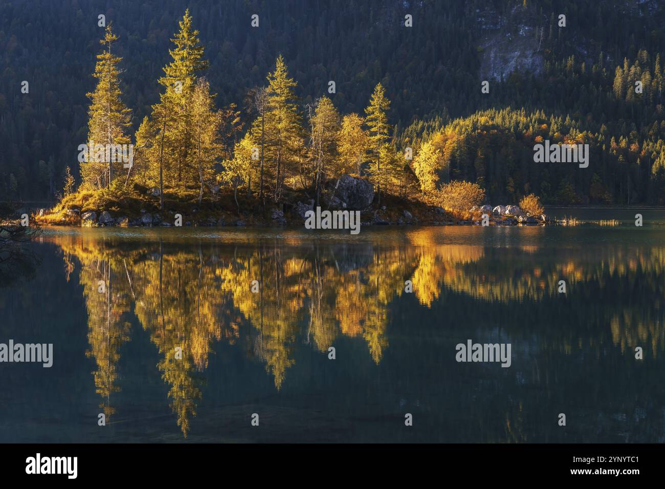 Lake Eibsee with a small island near mountain Zugspitze in south ...