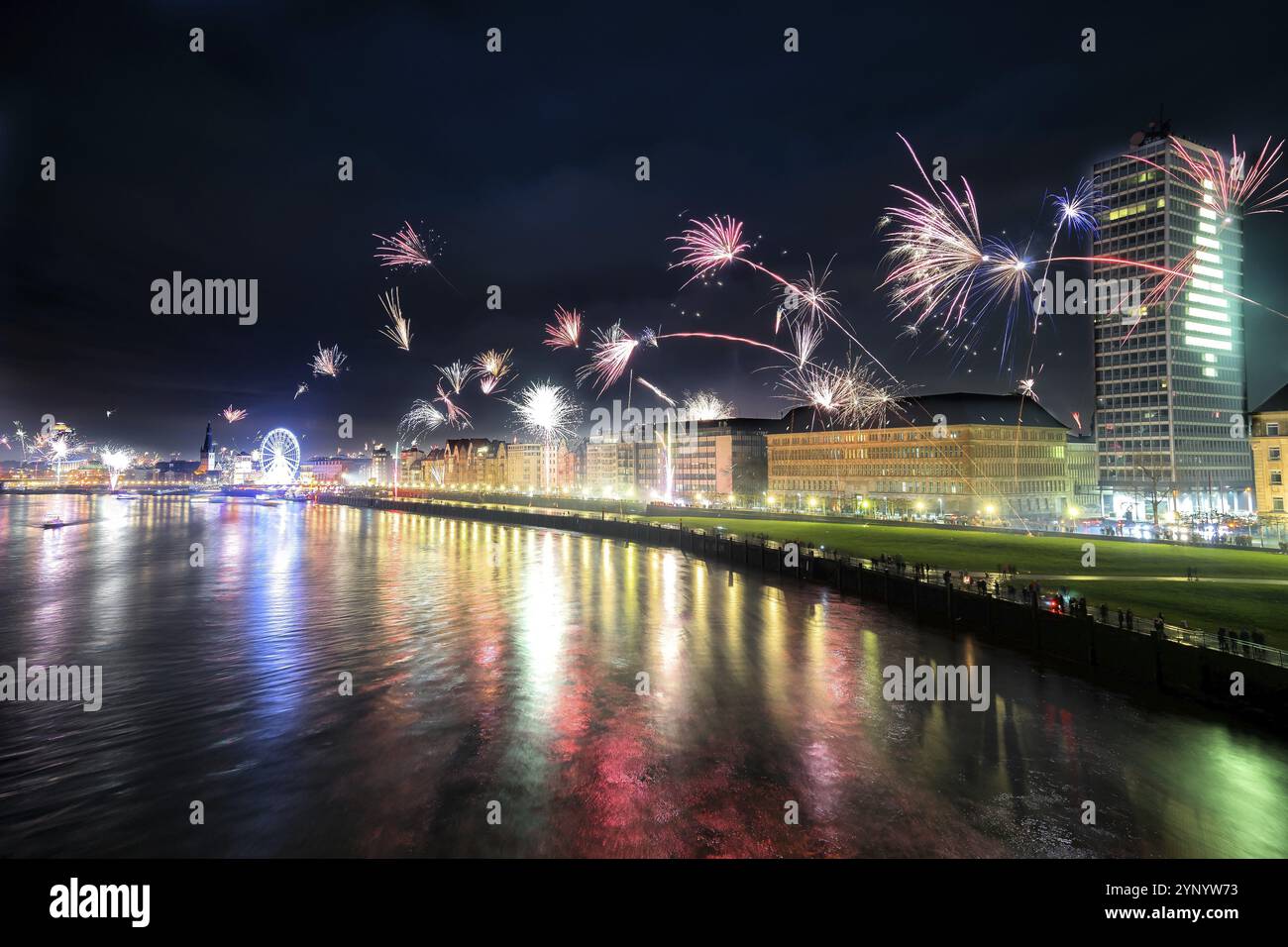Rhine Promenade In Duesseldorf On New Year S Eve With Fireworks And The