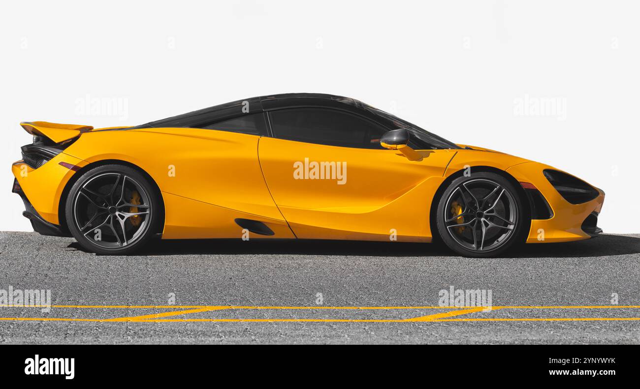 Luxury power sports car side view. Yellow modern sports car parked in ...