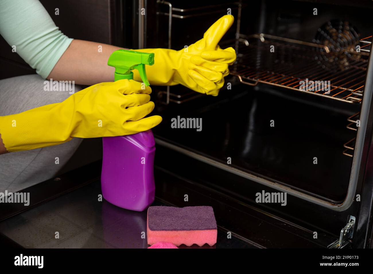 Clean your oven safely using appropriate products while wearing gloves ...