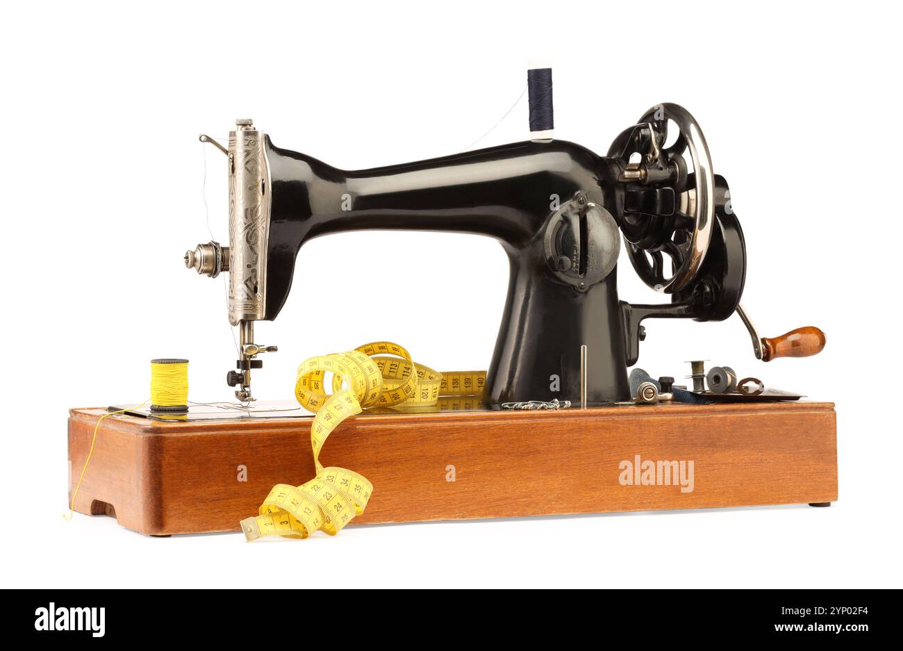 Sewing machine, measuring tape, safety pins and spools of threads ...