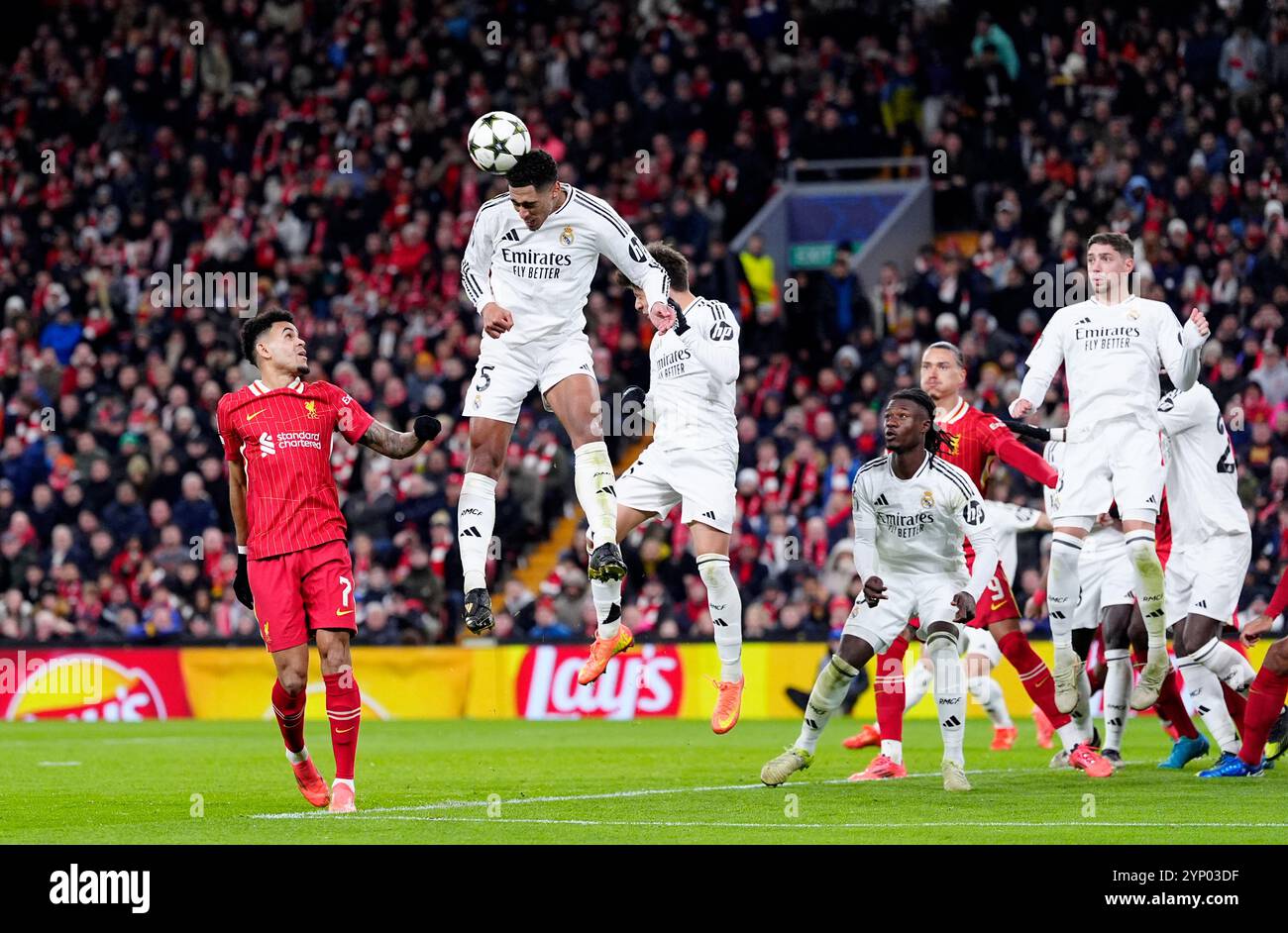 Real Madrid's Jude Bellingham heads clear from a corner kick during the ...