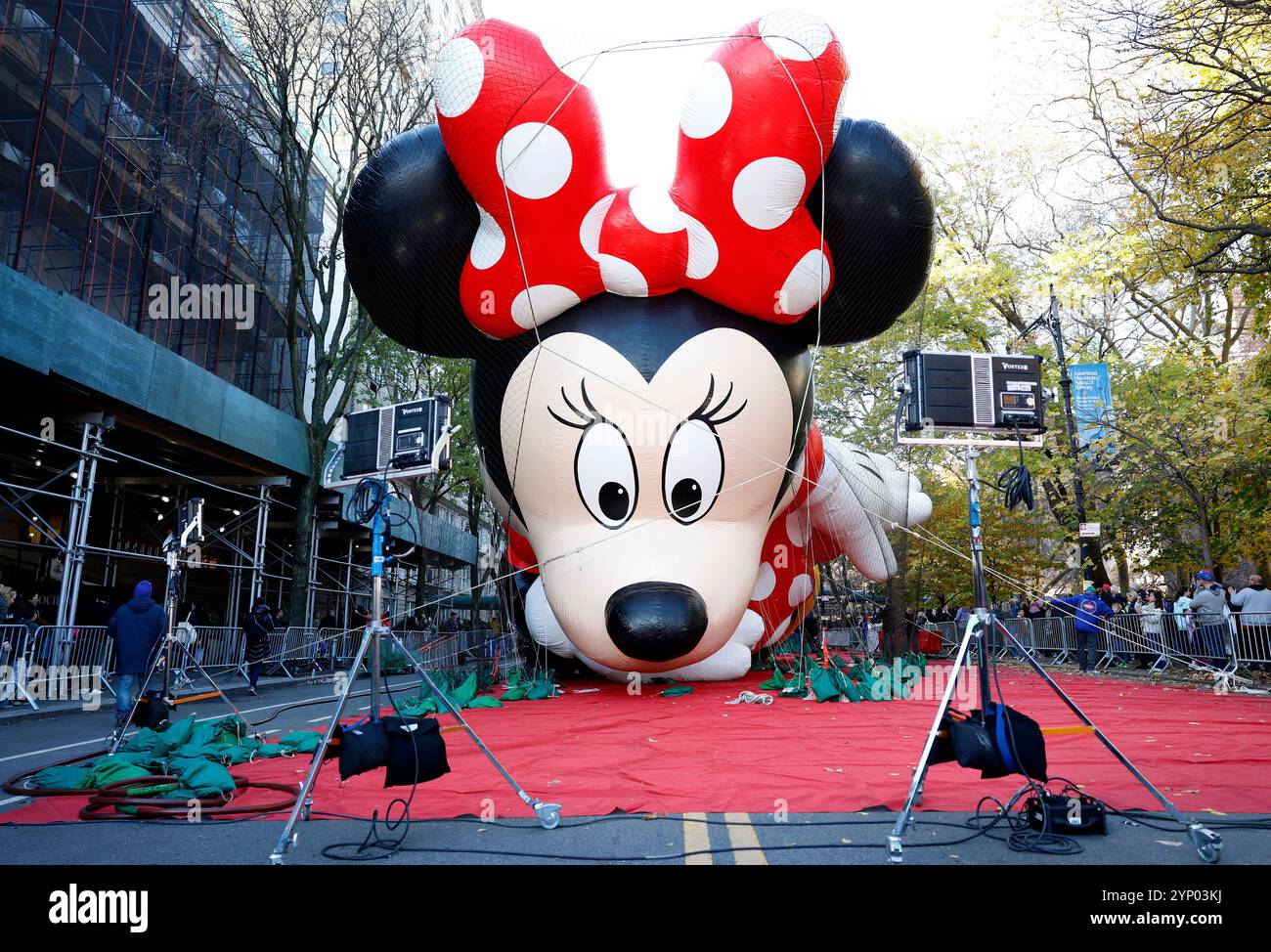 Disney's Minnie Mouse balloon is held in position after being inflated ...