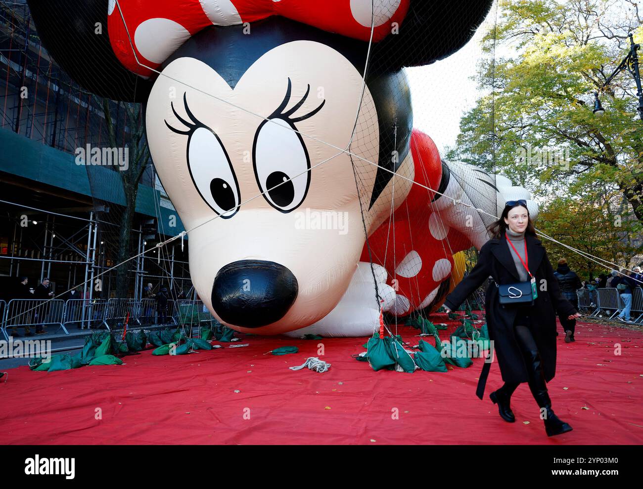 Disney's Minnie Mouse balloon is held in position after being inflated ...