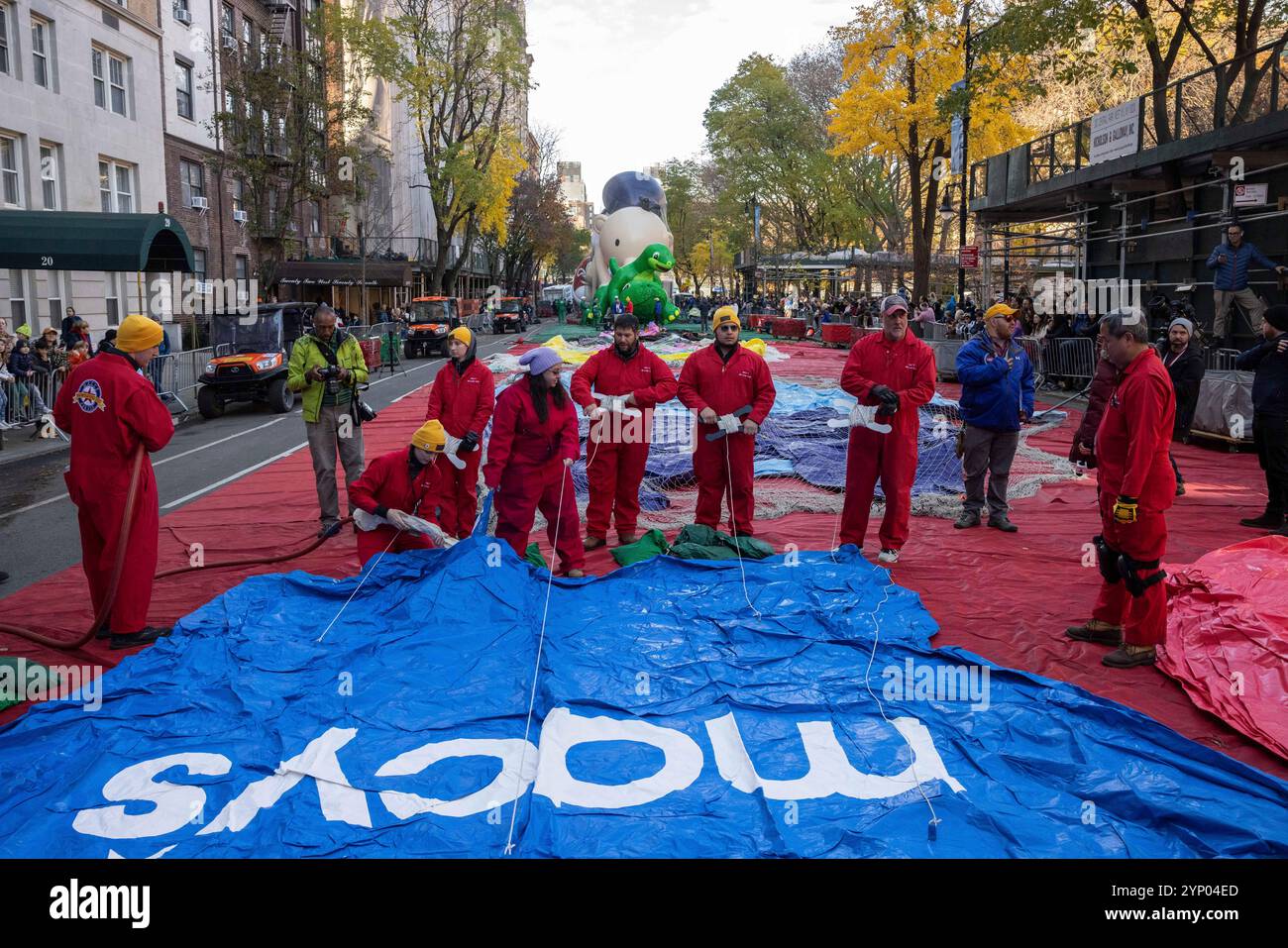 People inflate a float of Macy's Stars in preparation for the Macy's ...