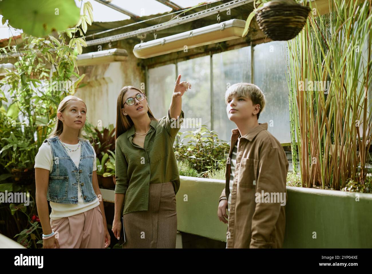 Woman Giving Tour In Botanical Garden Stock Photo - Alamy