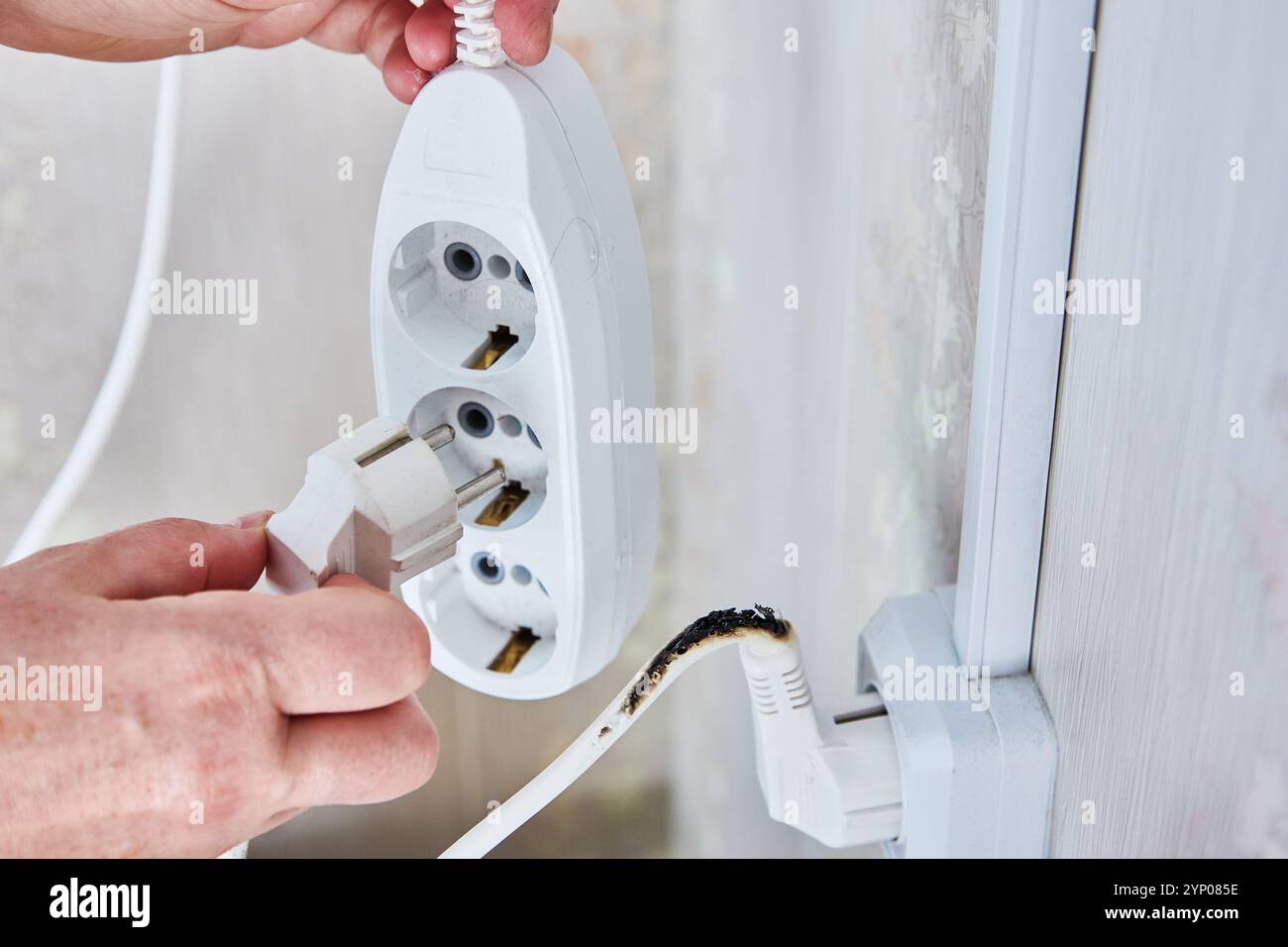 An electrical plug with burnt wire in socket Stock Photo - Alamy