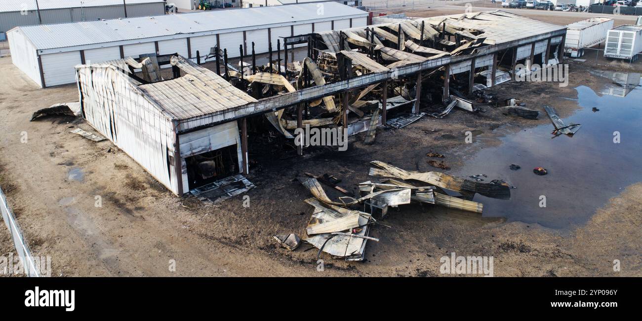 A building has been destroyed by fire. The fire has caused a lot of ...