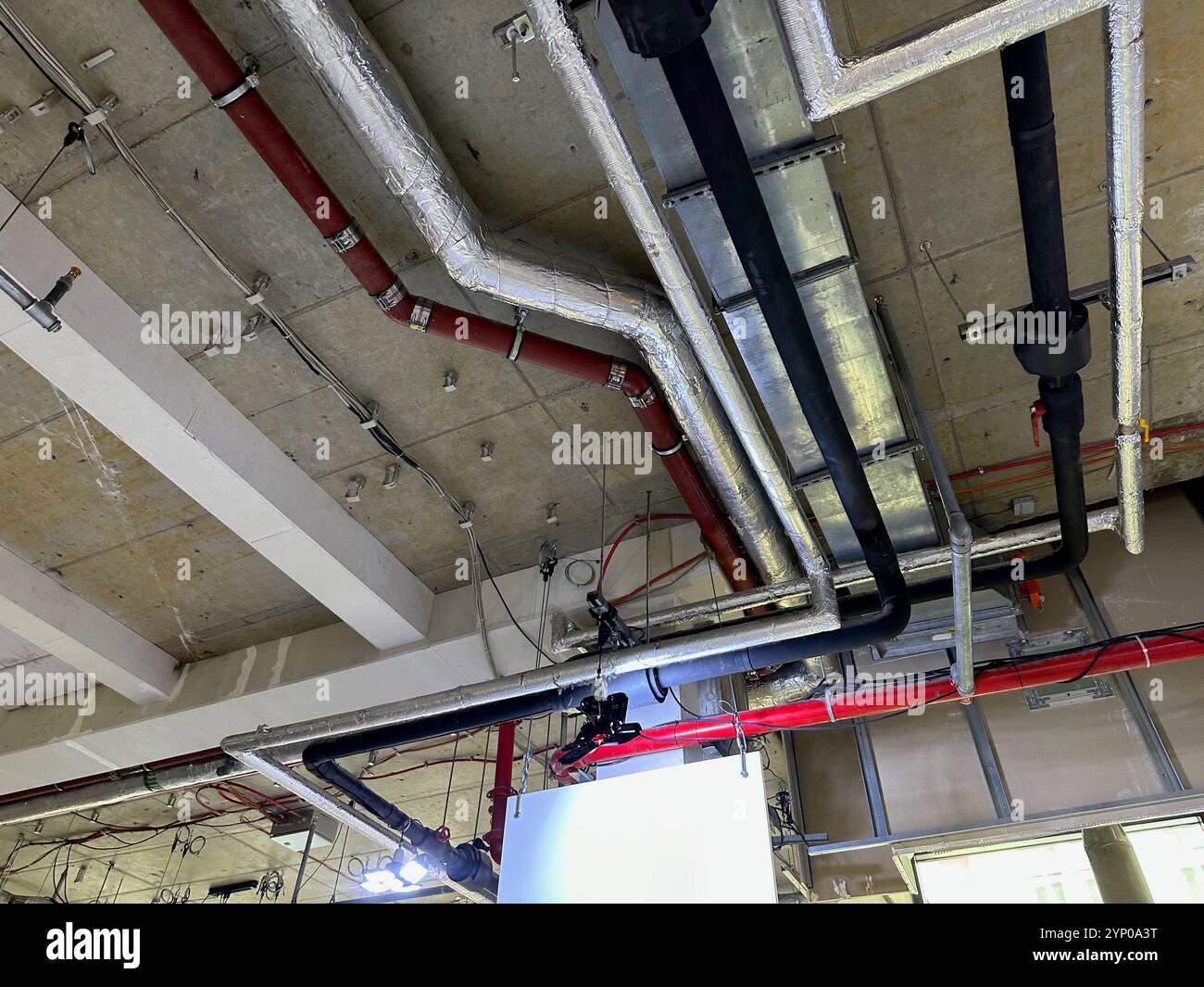 Pressurisation ductwork system on ceiling indoors, view from below ...