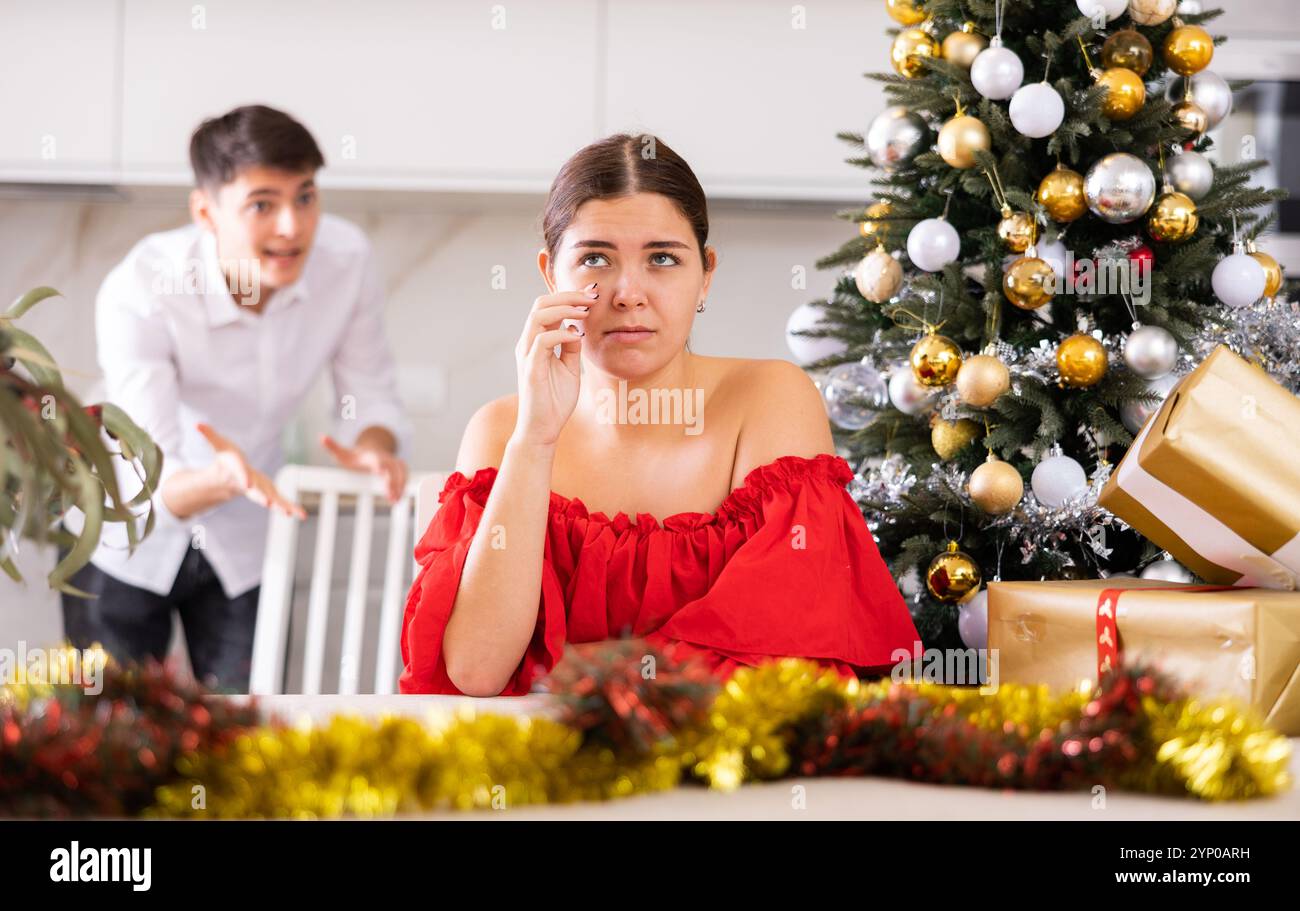 Annoyed young male and female getting mad at each other while standing ...