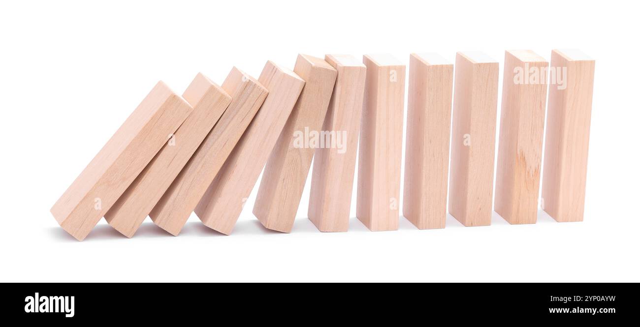 Domino effect. Wooden blocks falling on white background Stock Photo ...