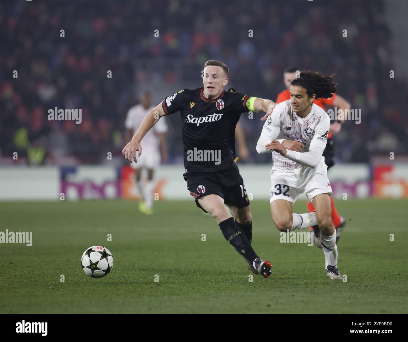Ayyoub Bouaddi of LOSC Lille and Lewis Ferguson of Bologna FC during ...