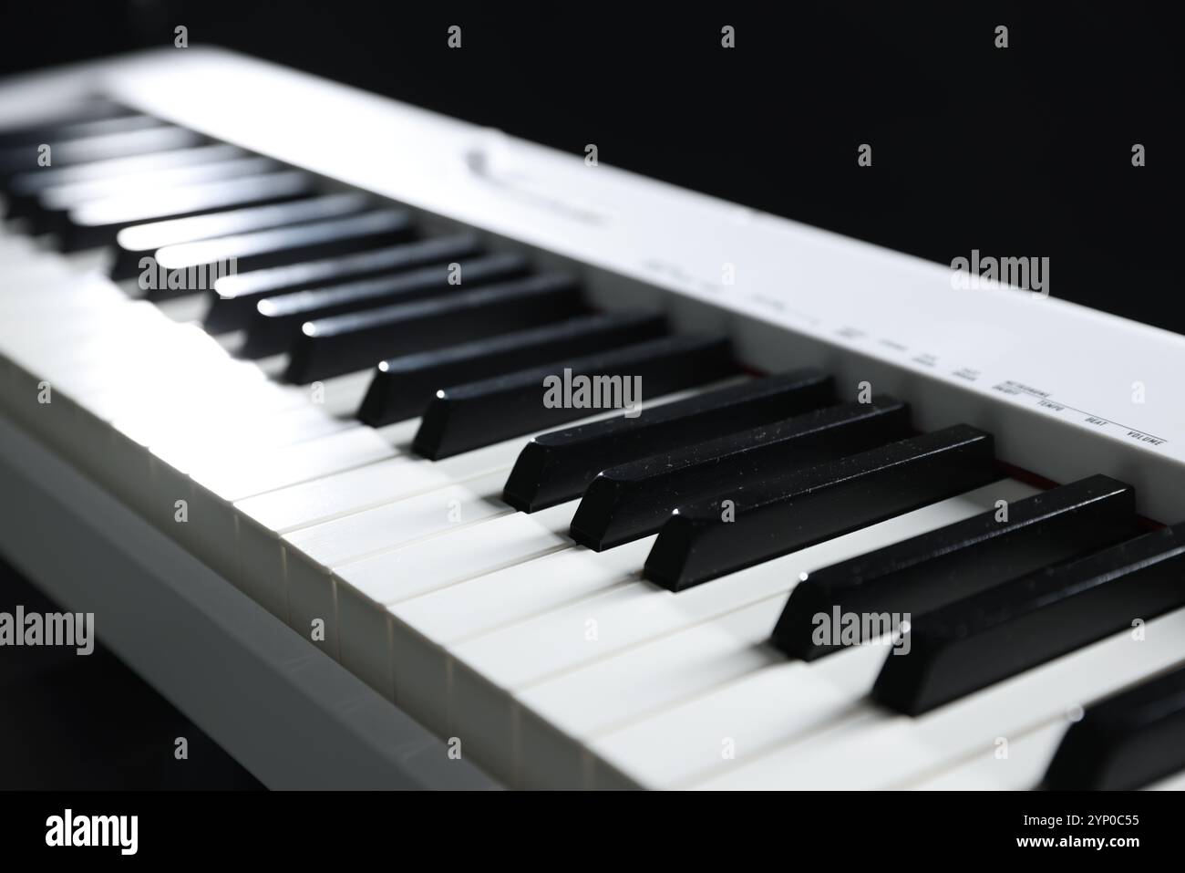 Synthesizer on black background, closeup. Electronic musical instrument ...