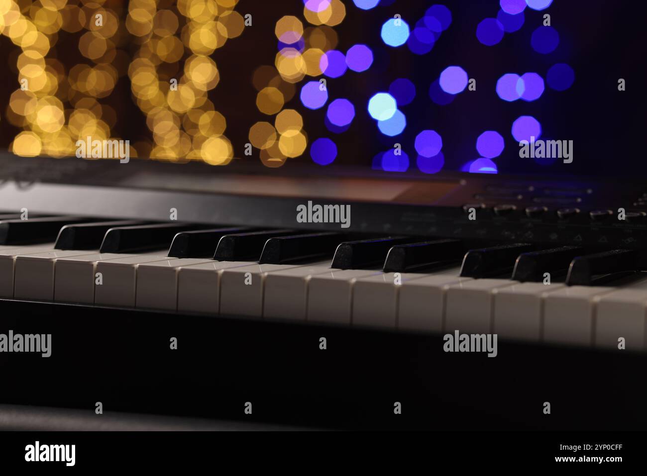 Piano against blurred lights, closeup. Bokeh effect Stock Photo - Alamy