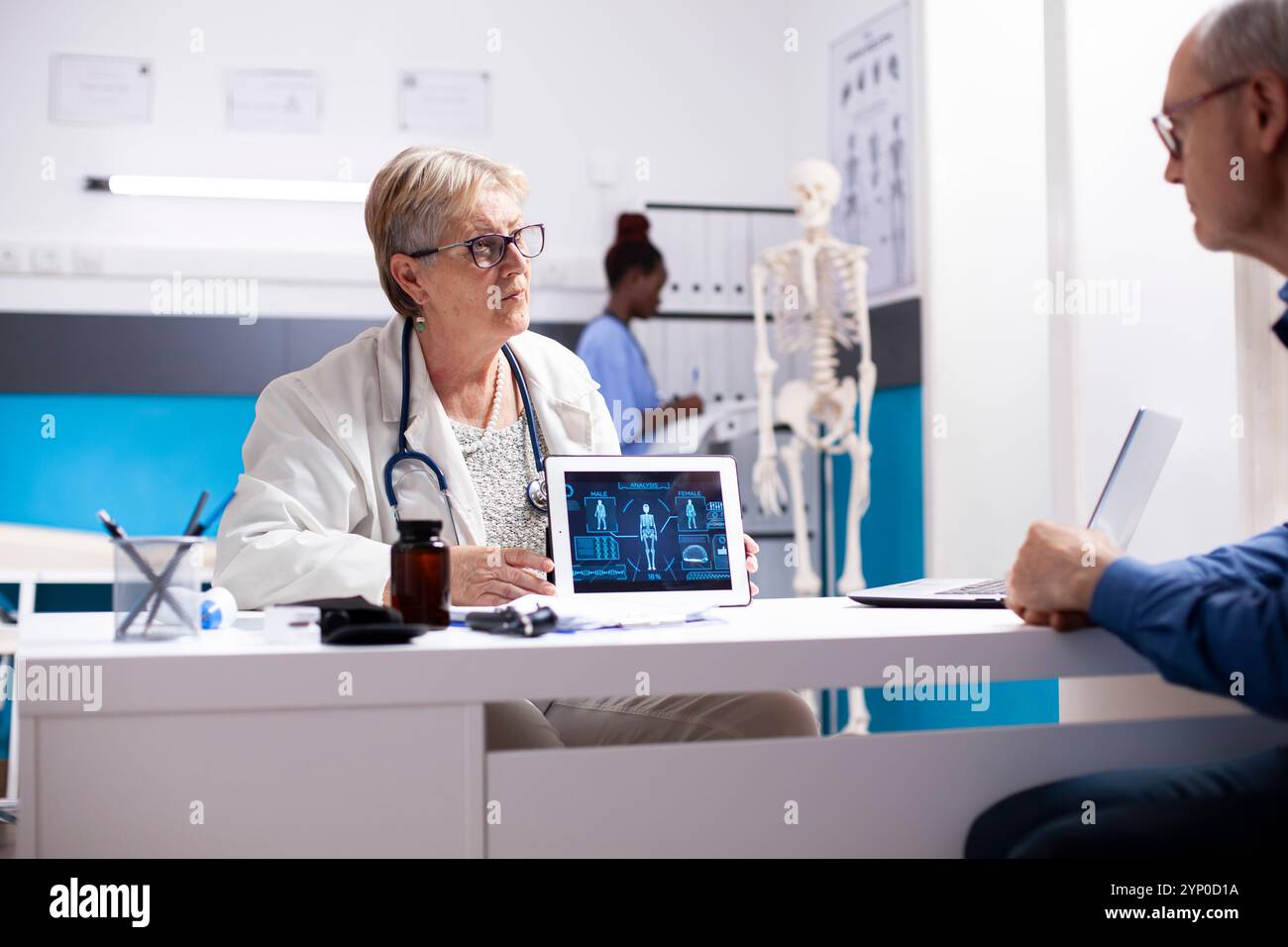 Senior woman doctor carefully guides retired male patient through ...