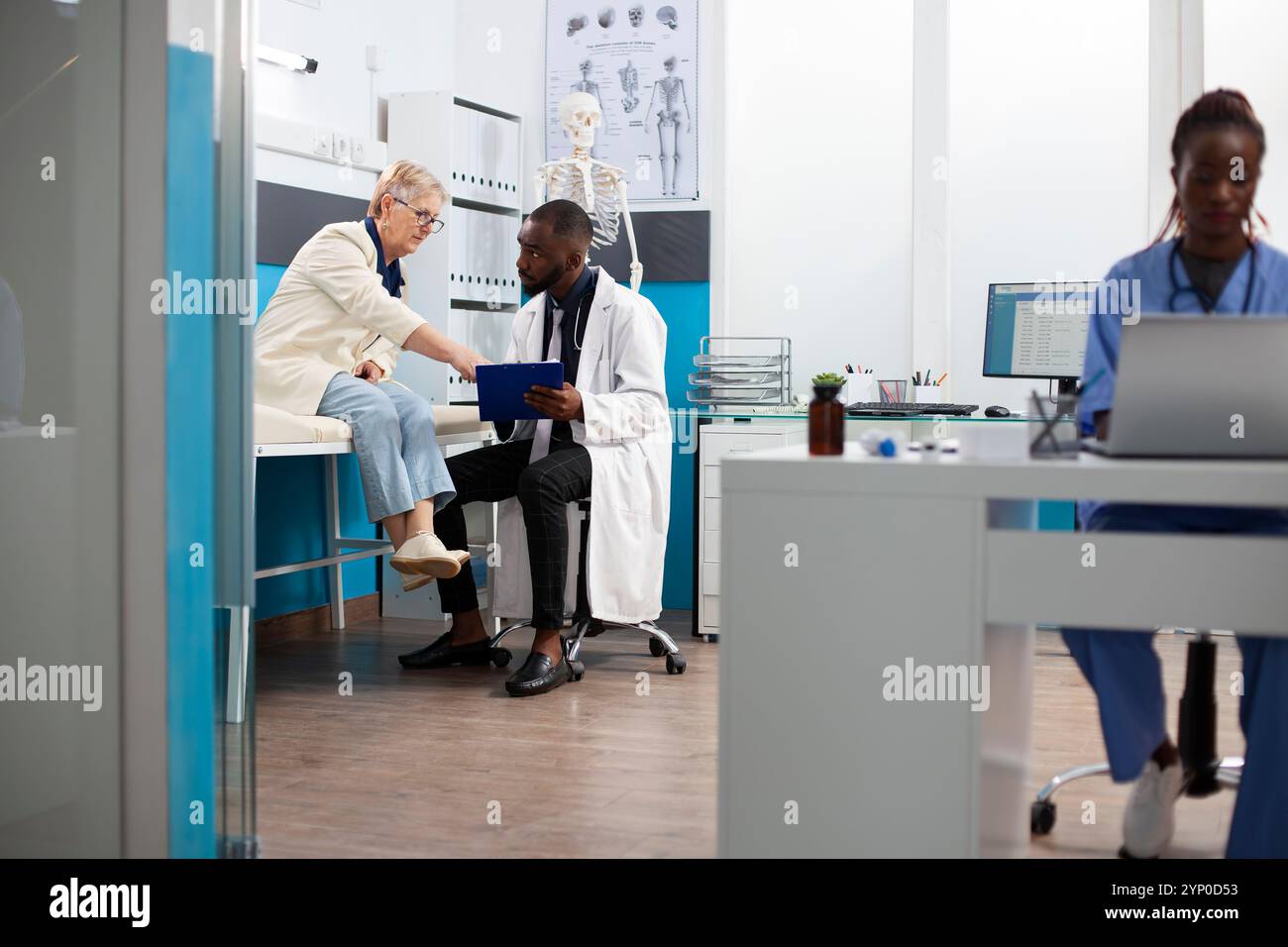 Black doctor engages in conversation with retired white woman using ...