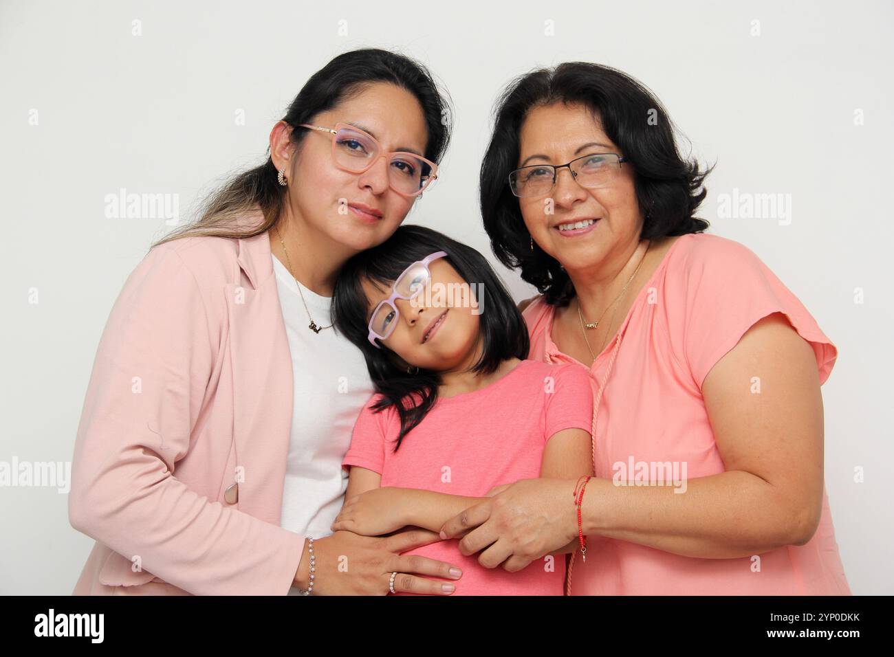 Three generations of brunette Latina women, grandmother, mom and ...