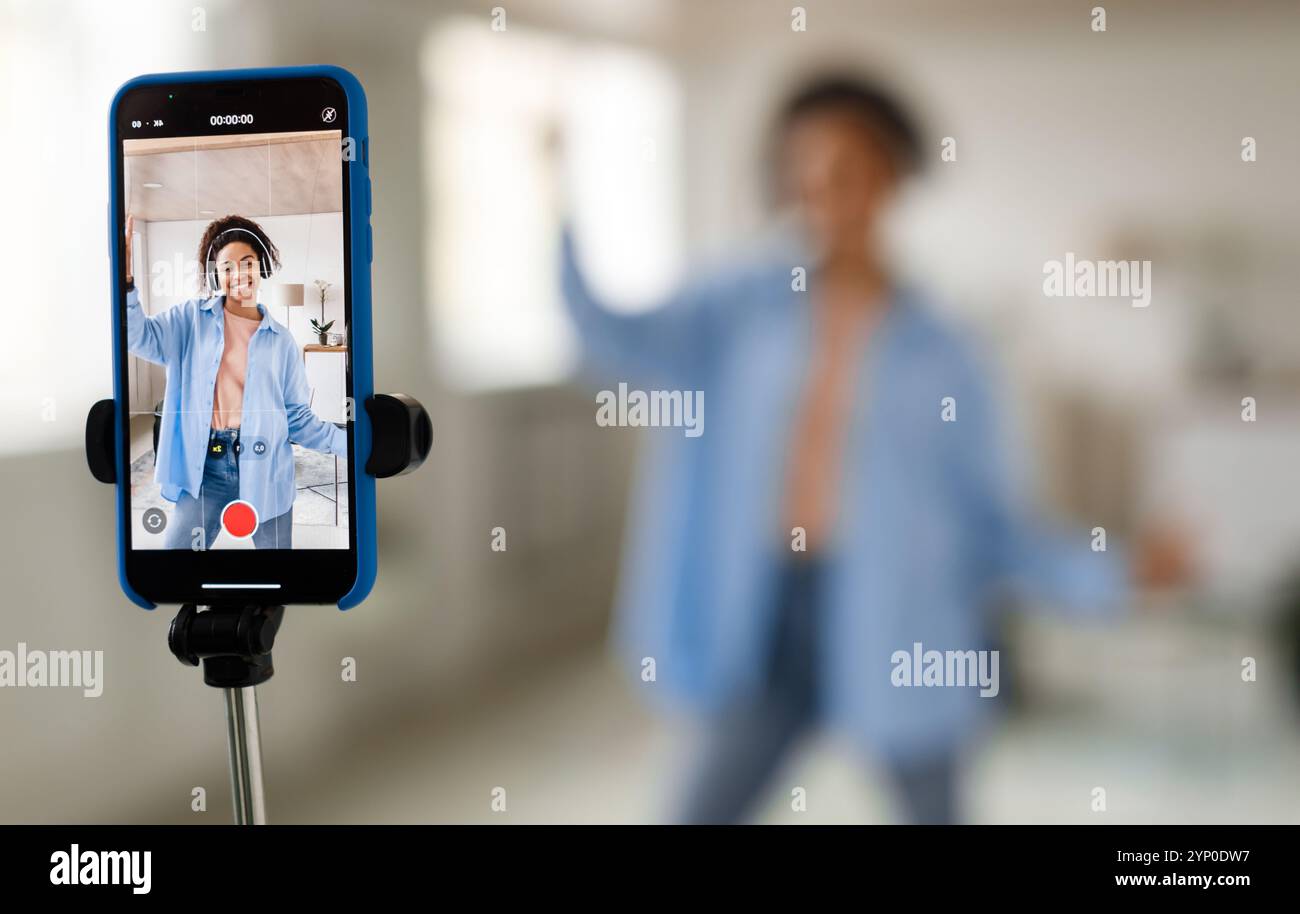Black woman recording video on hi-res stock photography and images - Alamy