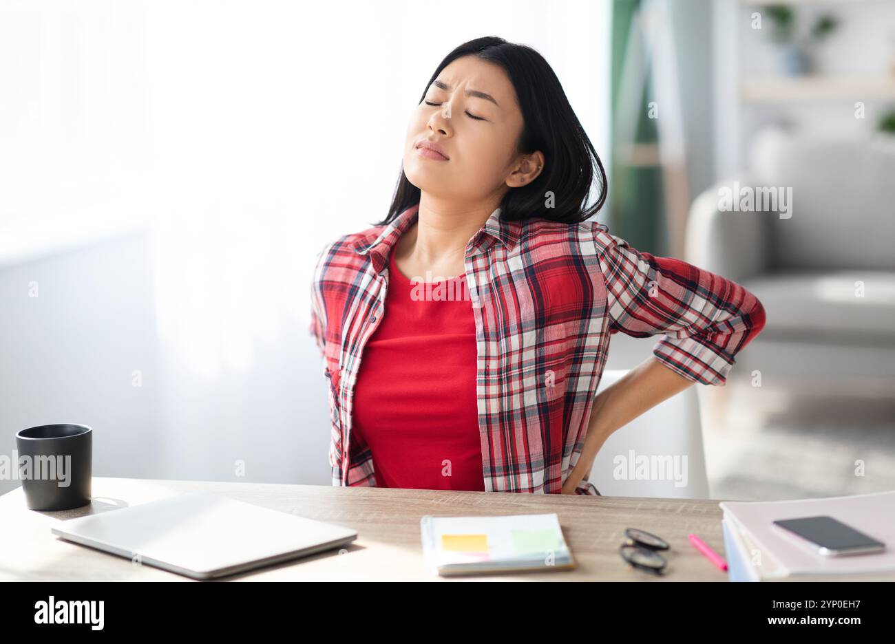 Beautiful Young Asian Woman Suffering From Backache While Working In ...