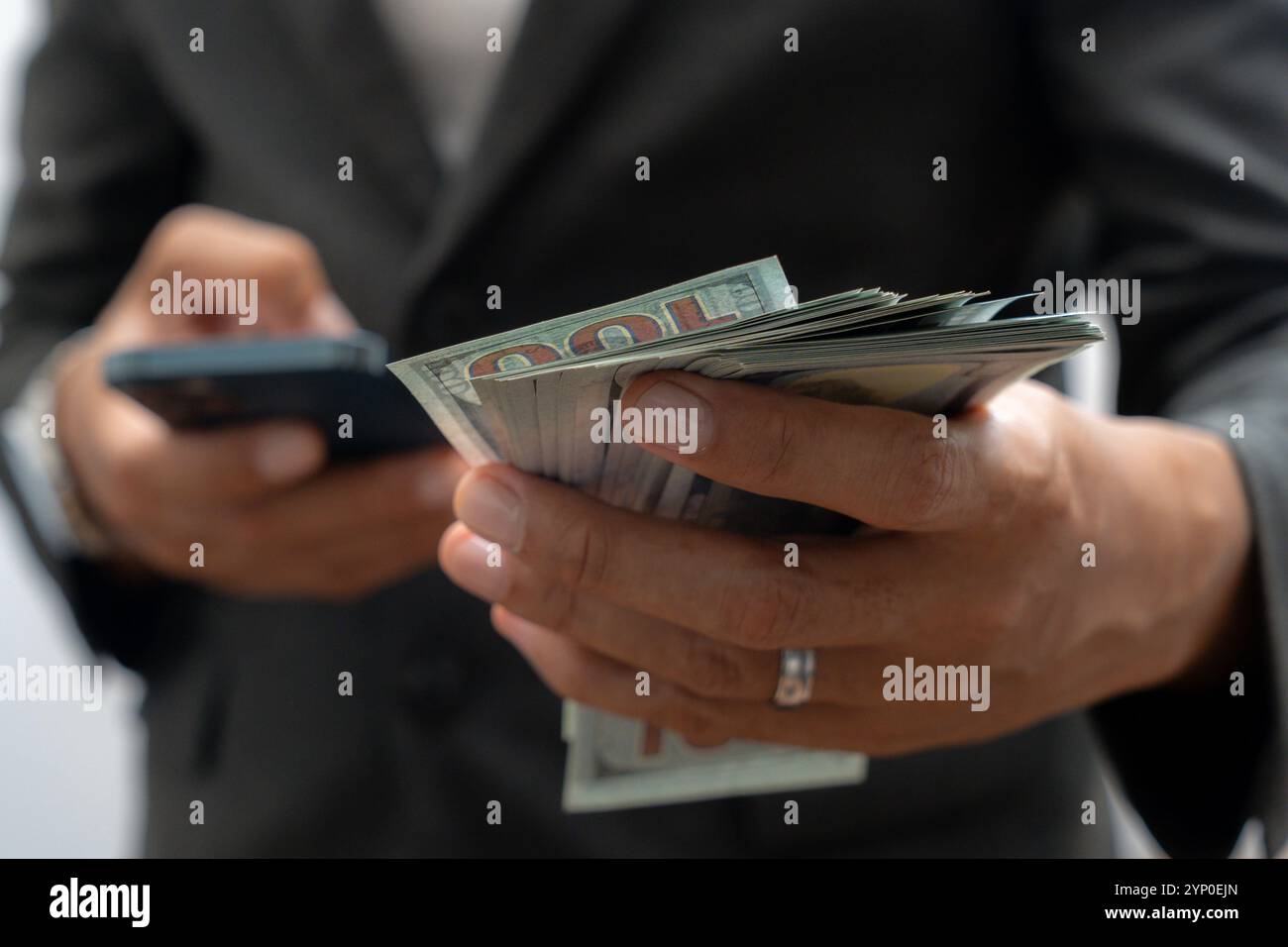 Man counting dollar bills close hi-res stock photography and images - Alamy