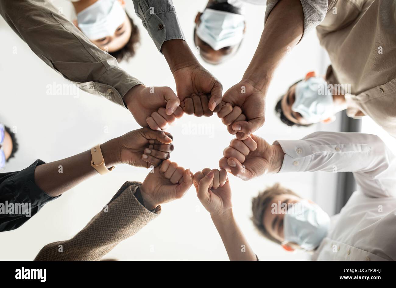 Portrait of diverse business people giving fist bump in cirle Stock ...
