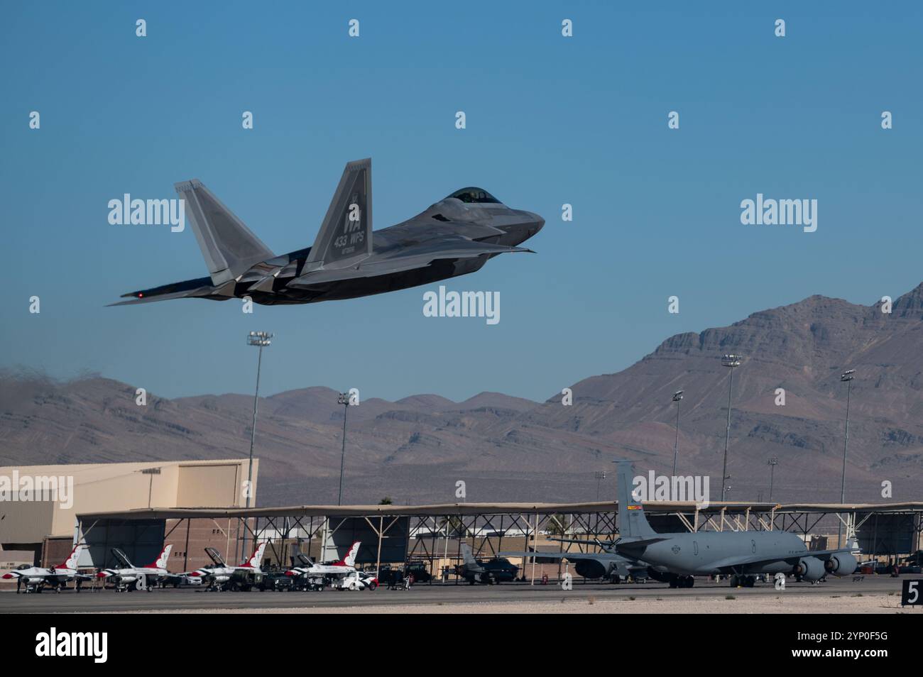 An F-22 Raptor assigned to the 433rd Weapons Squadron, takes off for a ...