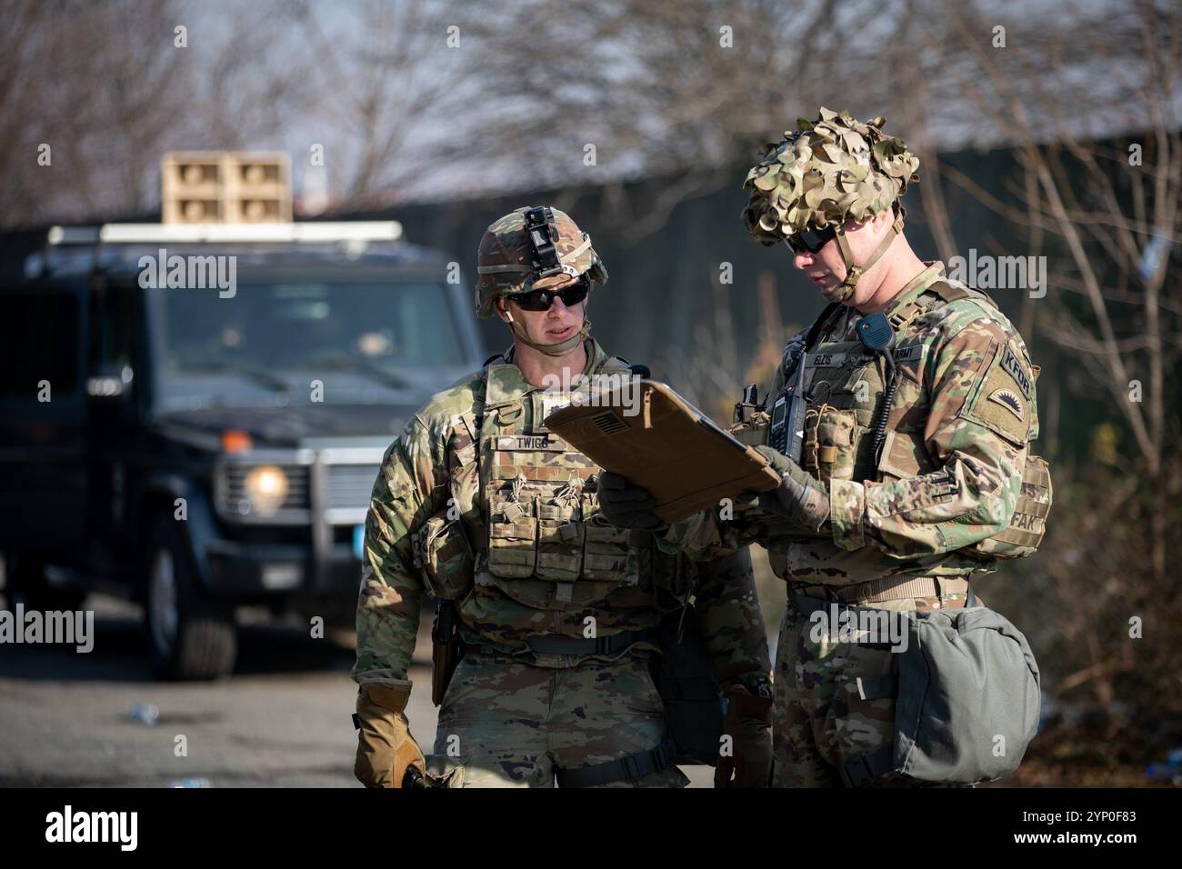 Multinational soldiers with the NATO-led Kosovo Force mission, also ...